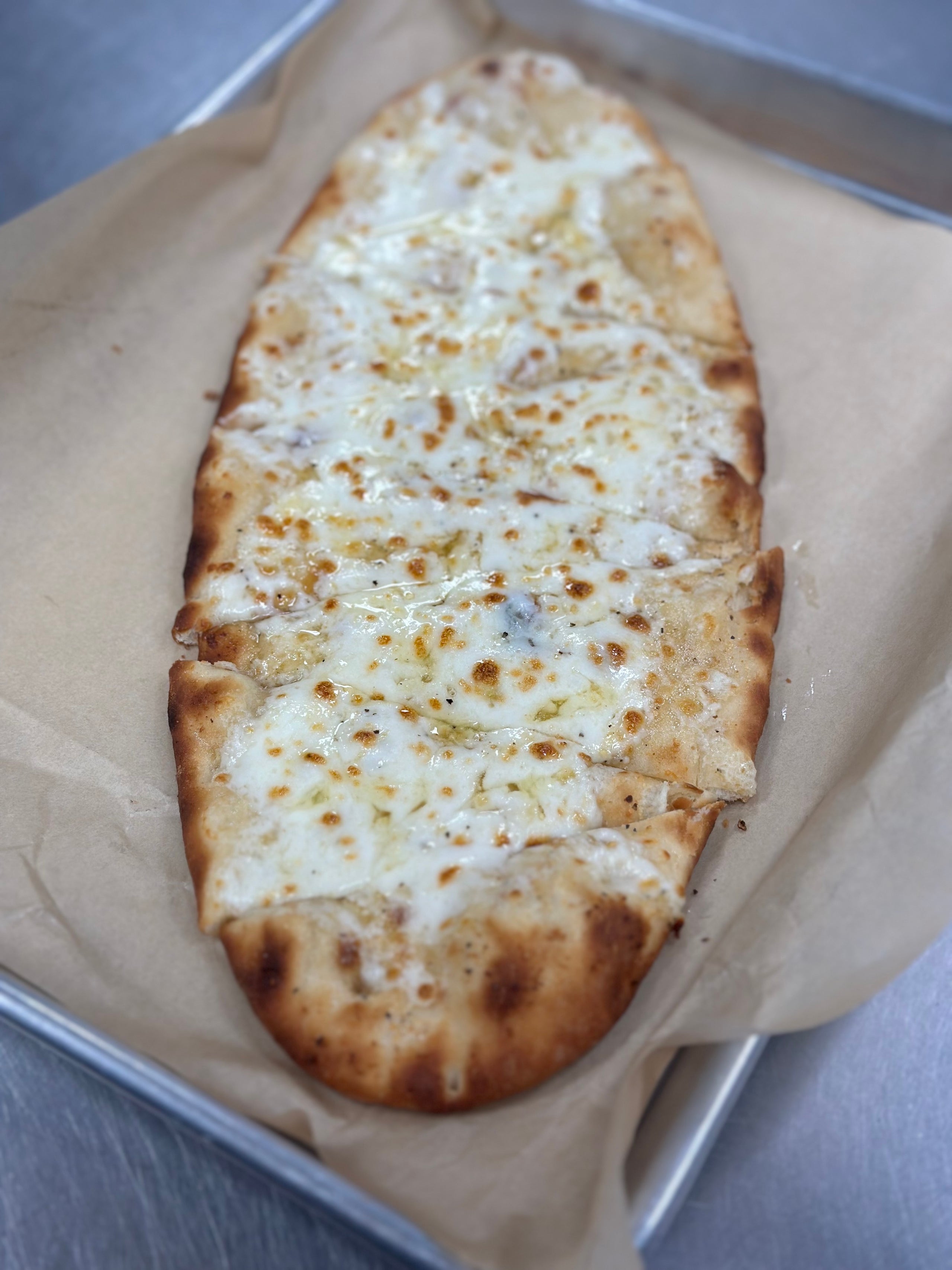 Garlic Butter & Cheese Flatbread (Online Menu) | Canary Bar & Grill